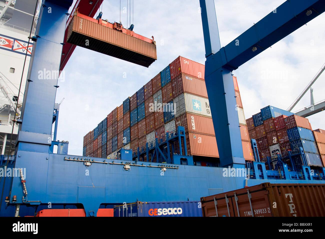 A Post-Panamax crane unloads containers at a European port Stock Photo ...