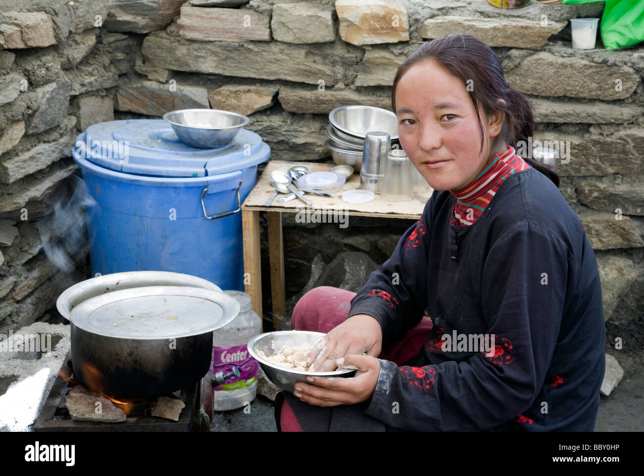Ladakhi woman cooking tsampa. Upshi. Manali-Leh road. Ladakh. India ...