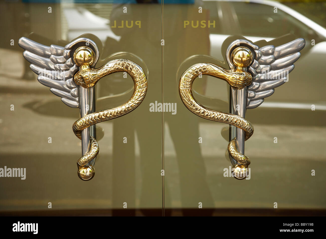 Snake shaped door handles Stock Photo - Alamy