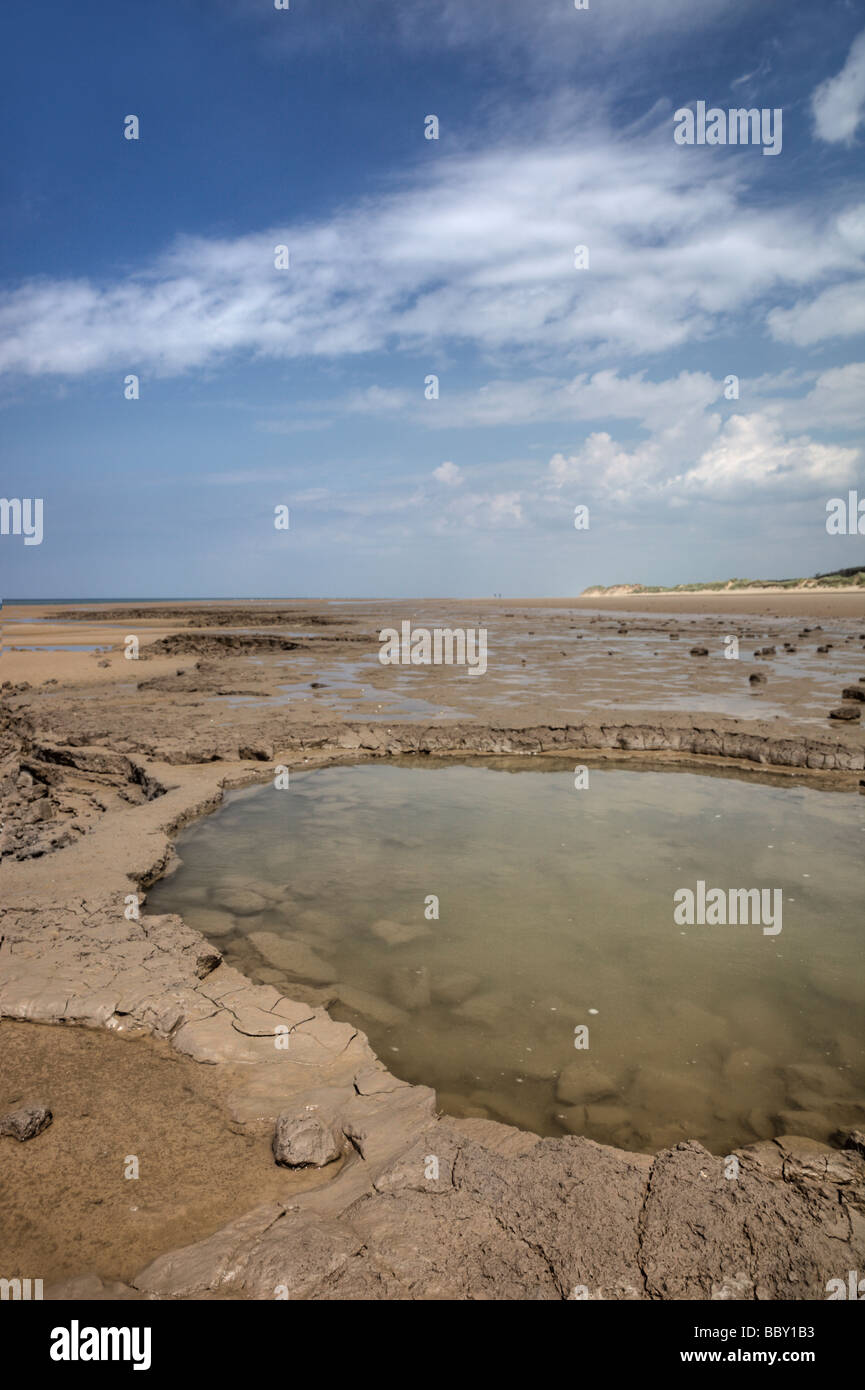 Ancient footprints in silt layers at Formby Stock Photo - Alamy