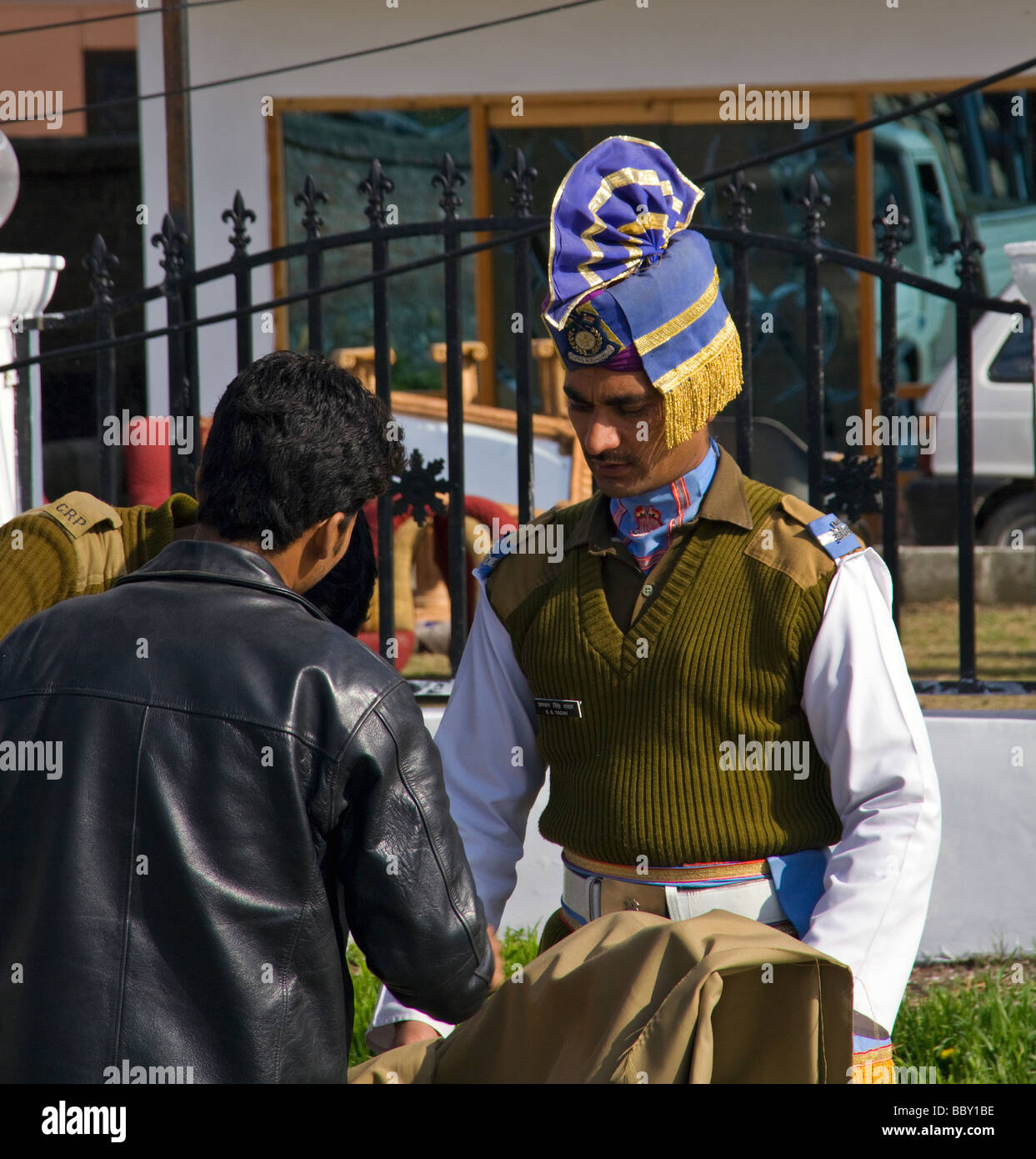 Security guard outside Srinagar hotel wearing traditional headdress ...