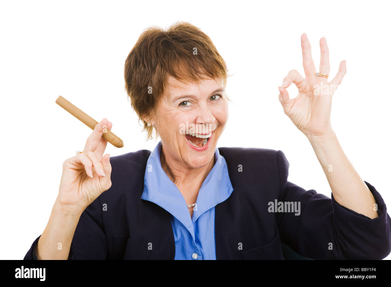 Successful businesswoman smoking a cigar and giving the AOkay sign ...