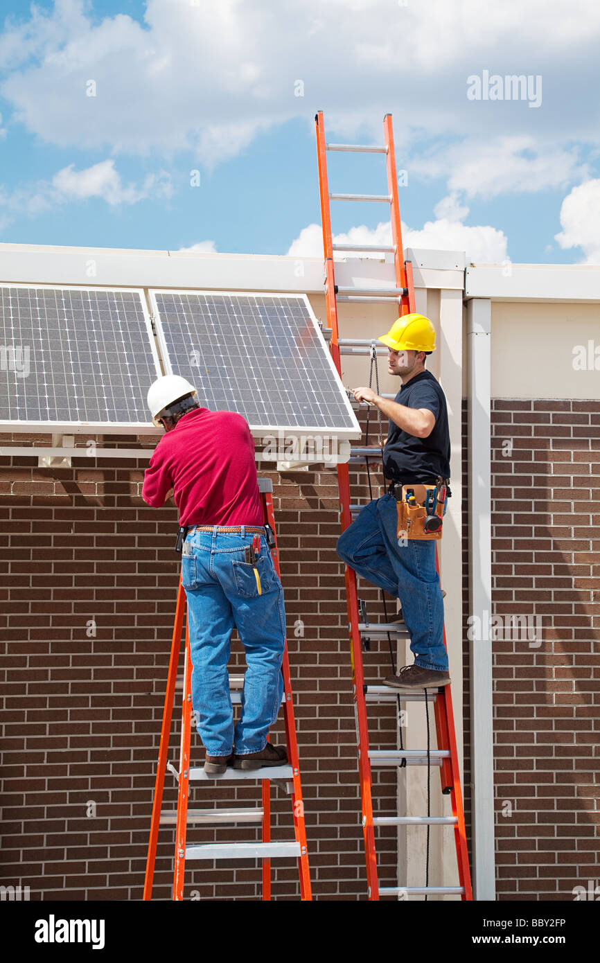 Construction workers install photovoltaic solar hi-res stock ...