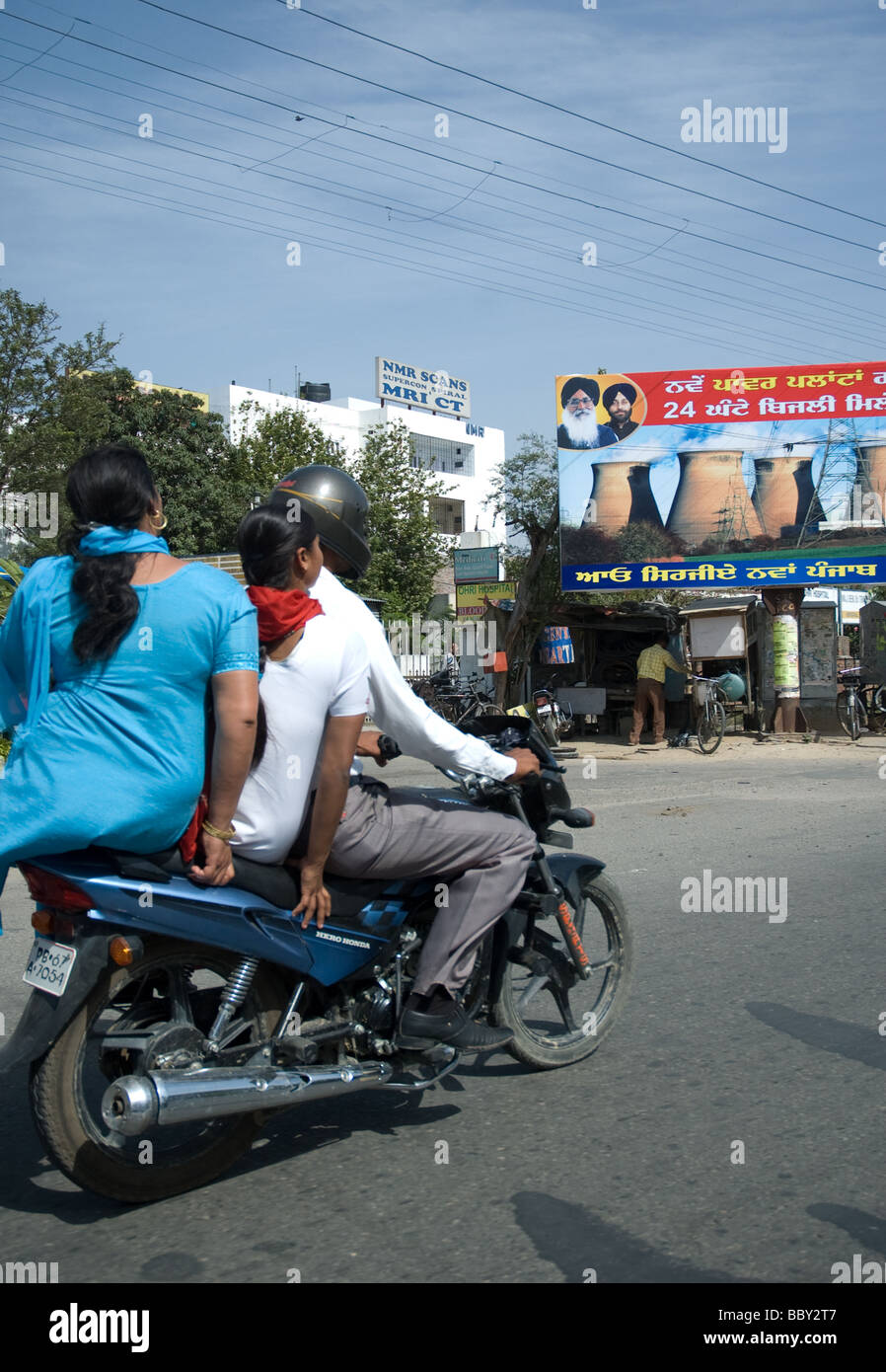 a motorbike with three passengers Stock Photo - Alamy