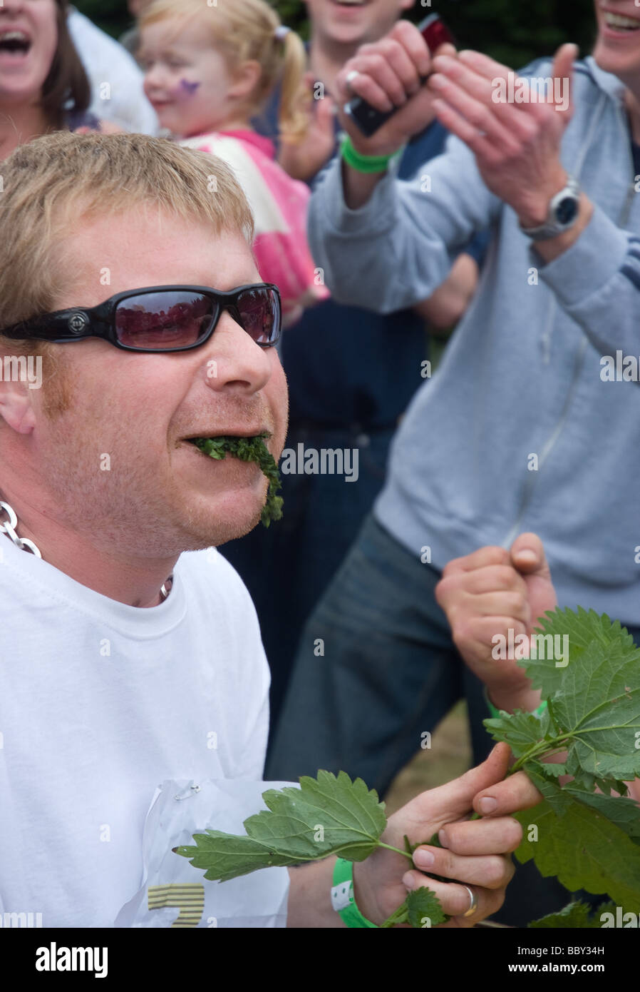 a competitor with a mouthfull of nettles at the world nettle eating ...