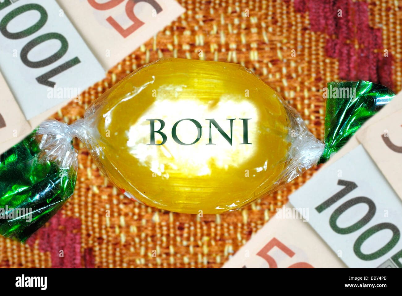 Candy with the words "bonuses" and bank notes, symbolic image for bonus ...