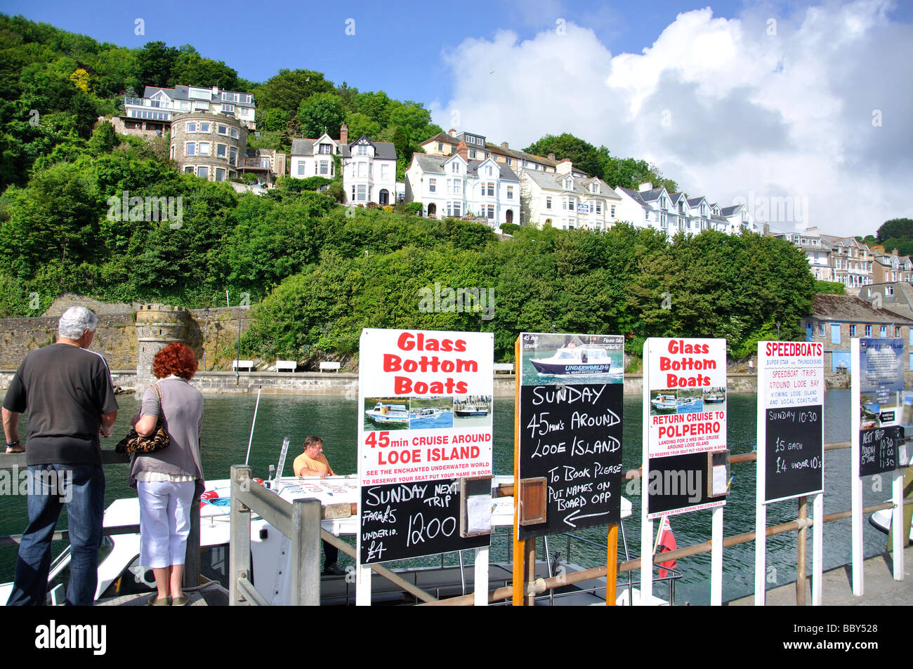 Excursion boat signs, Looe Harbour, Looe, Cornwall, England, United ...
