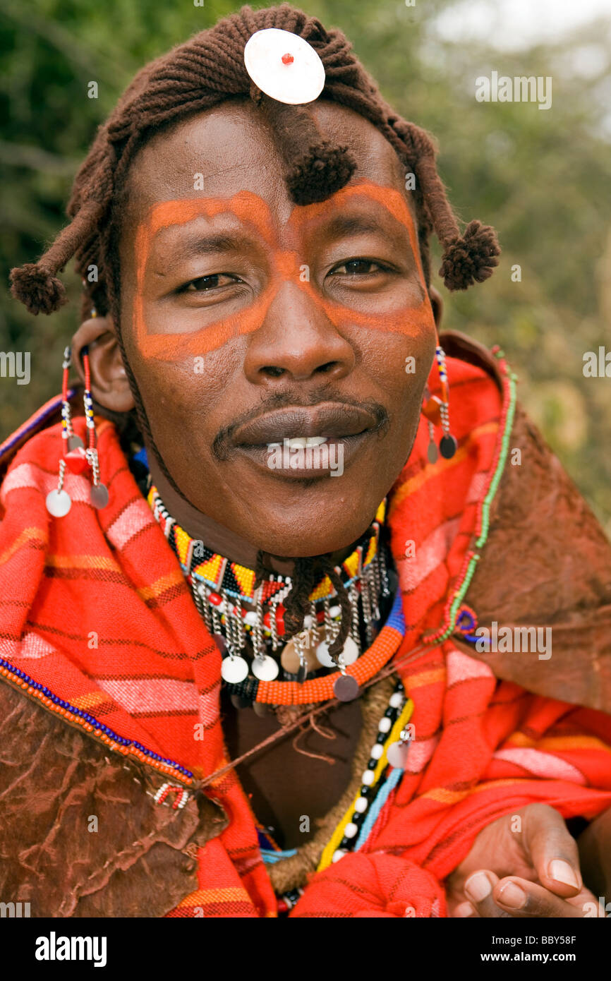 Portrait of Maasai warrior with painted face - Maji Moto Maasai Village ...