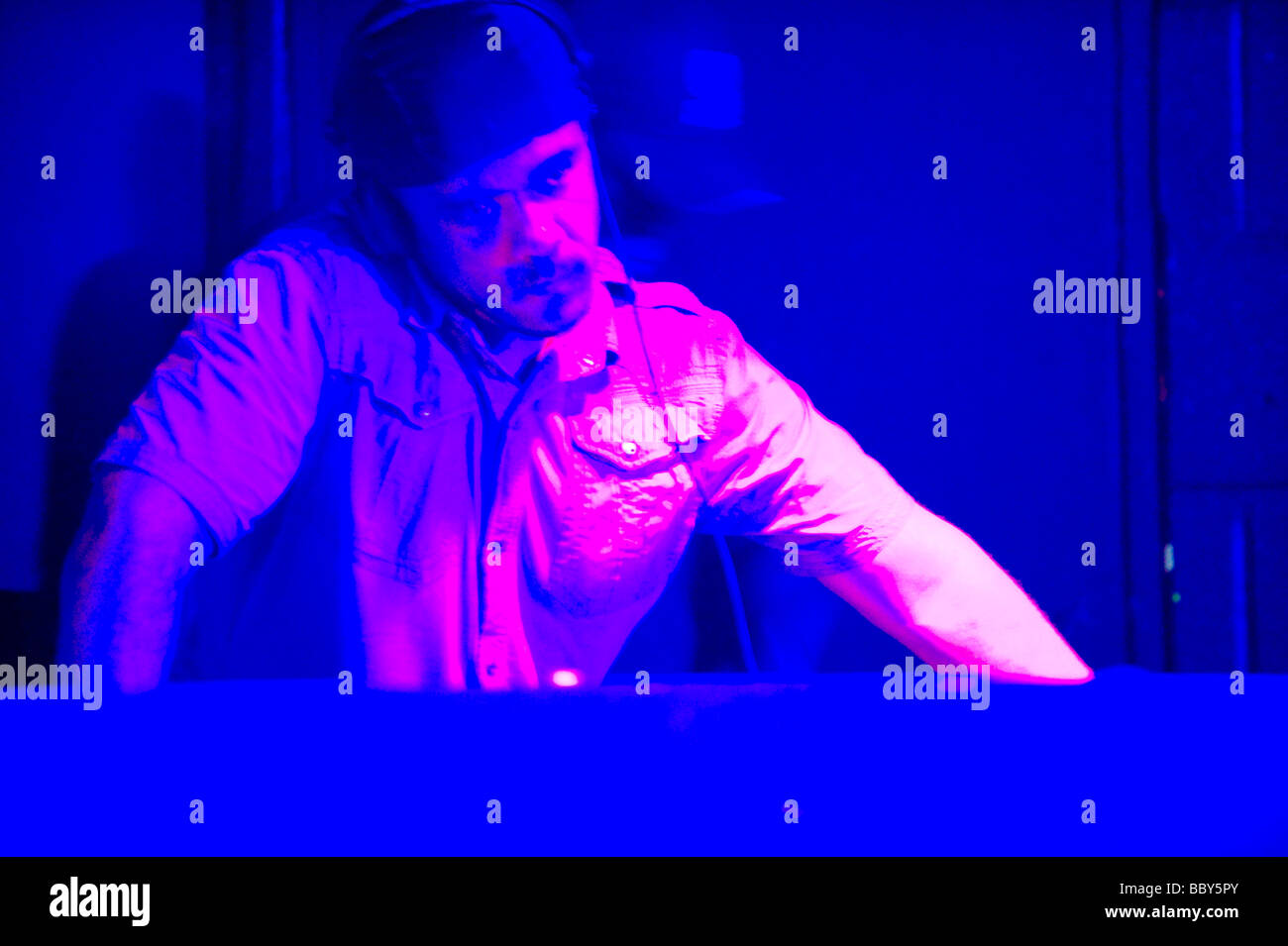 A DJ mixing at a night club Stock Photo - Alamy