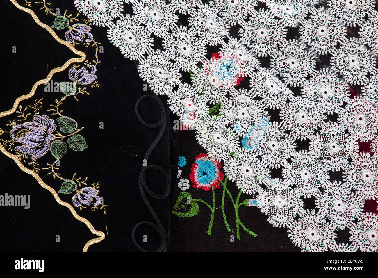 Delicate doily and black scarves on display in a marketplace in Turkey ...