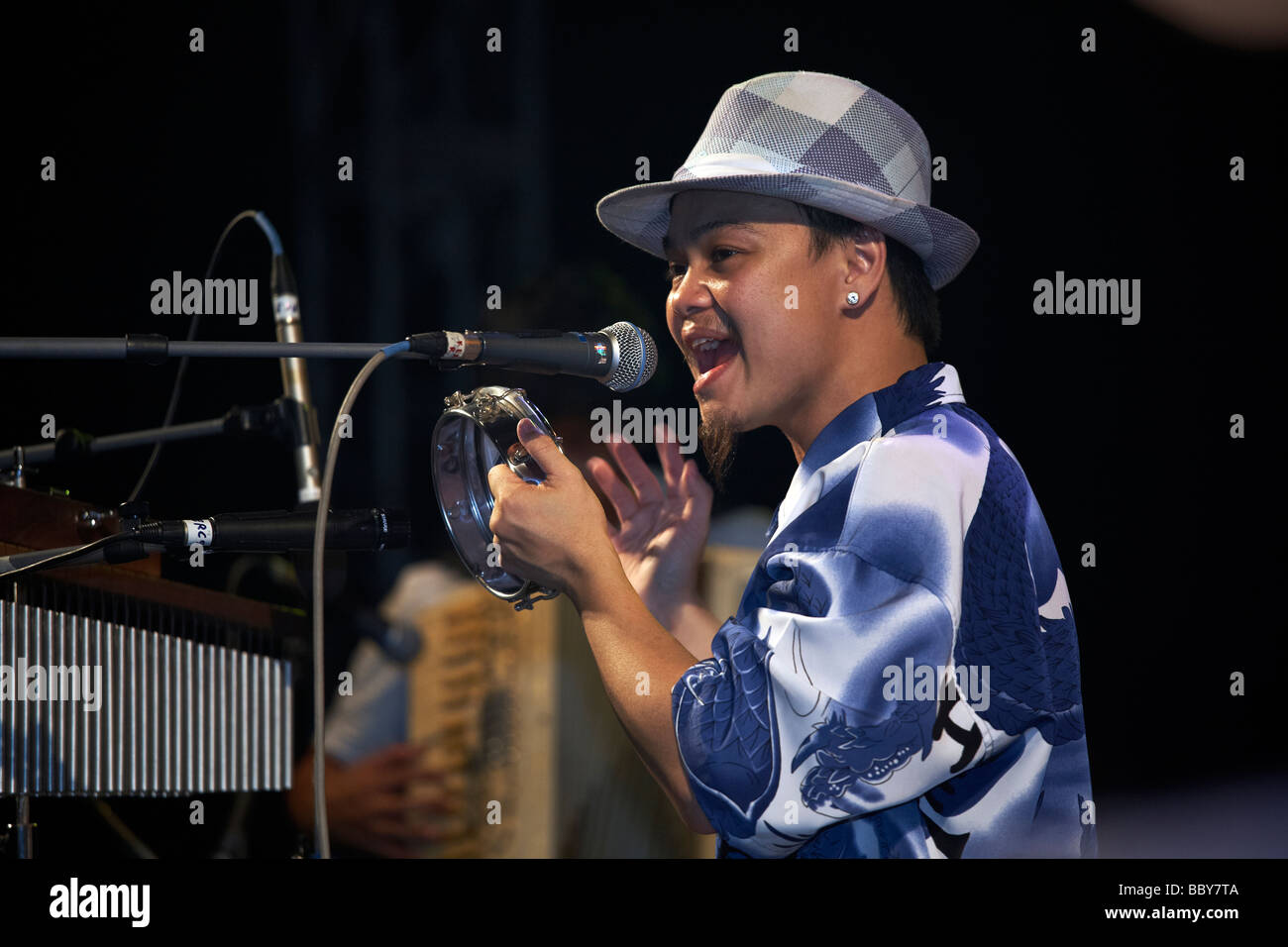 Male singer microphone. Doobadoo Thai Jazz band male singer performing ...