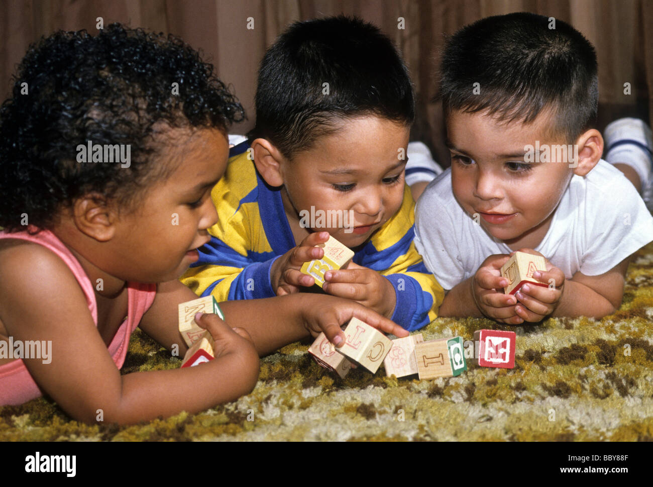 black boy, two hispanic latin play block toy share fun happy friend ...