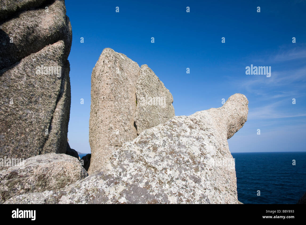 Granite sea cliffs at logan rock Headland in Porthcurno Cornwall UK ...