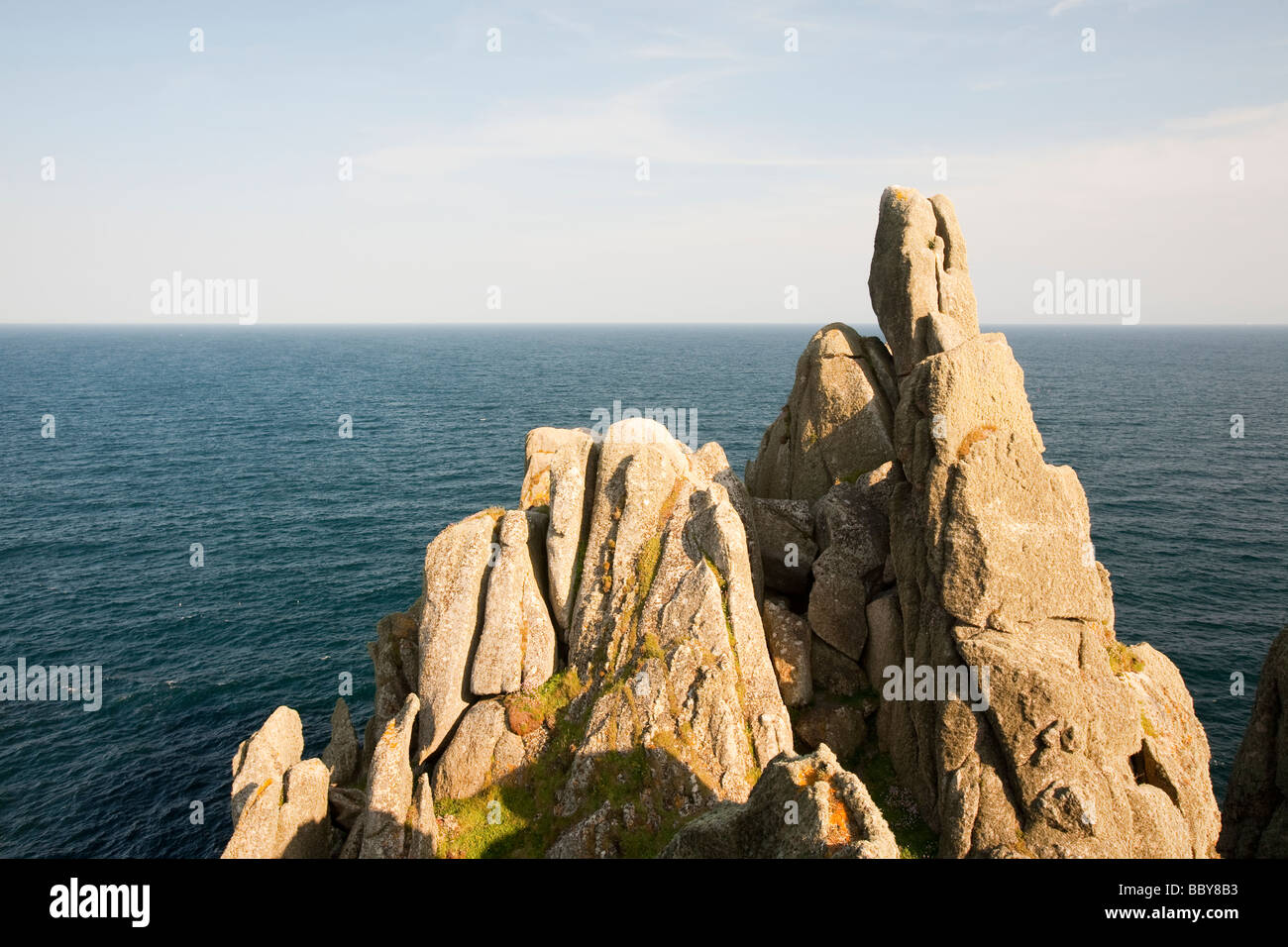 Granite sea cliffs at logan rock Headland in Porthcurno Cornwall UK ...