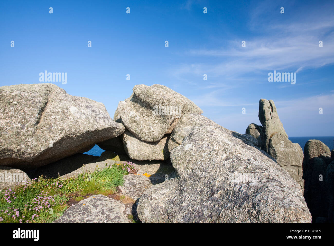 Granite sea cliffs at logan rock Headland in Porthcurno Cornwall UK ...