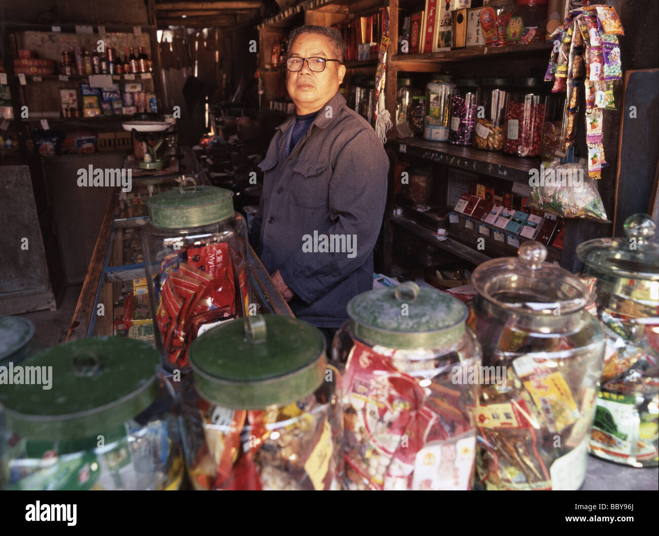 Shopkeeper in sweet shop, China Stock Photo - Alamy