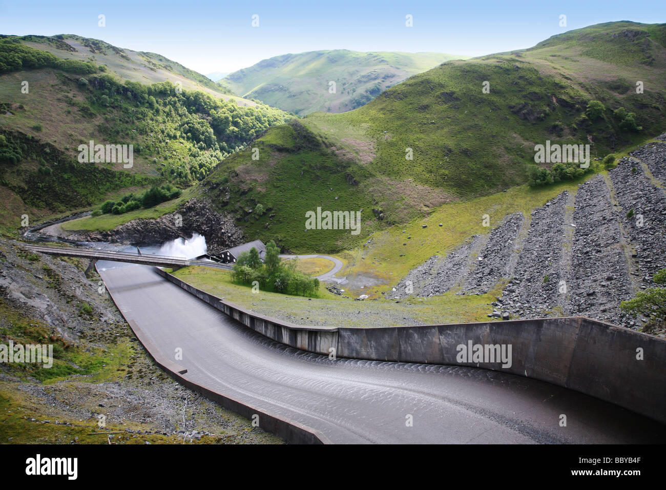 Looking down the concrete slipway on the dam at the end of the Llyn ...