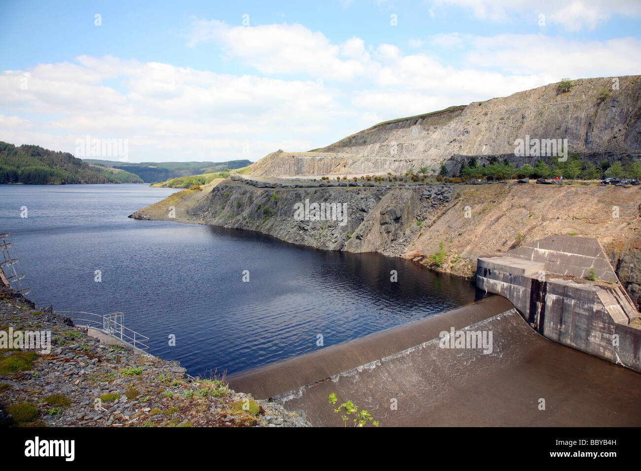 View of lake and top of the concrete slipway on the dam at the end of ...