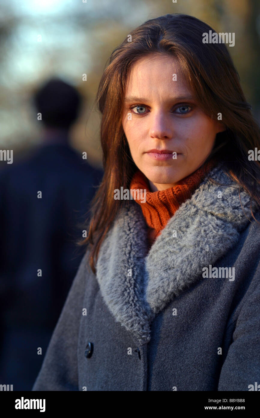 Splitting up, man walking away from jilted lover outside Stock Photo ...