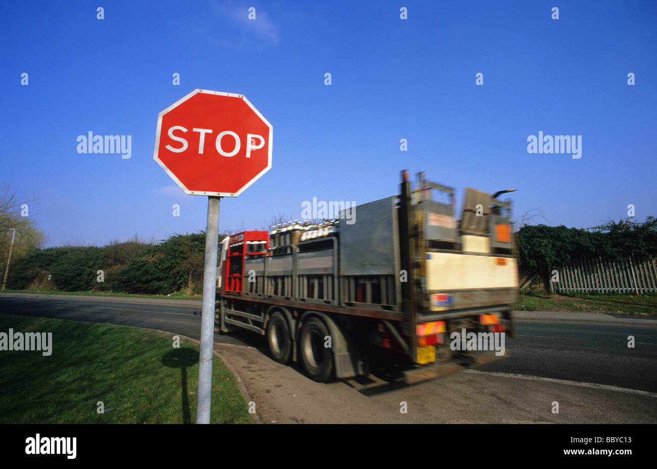 lorry passing stop sign at road junction near Leeds Yorkshire UK Stock ...