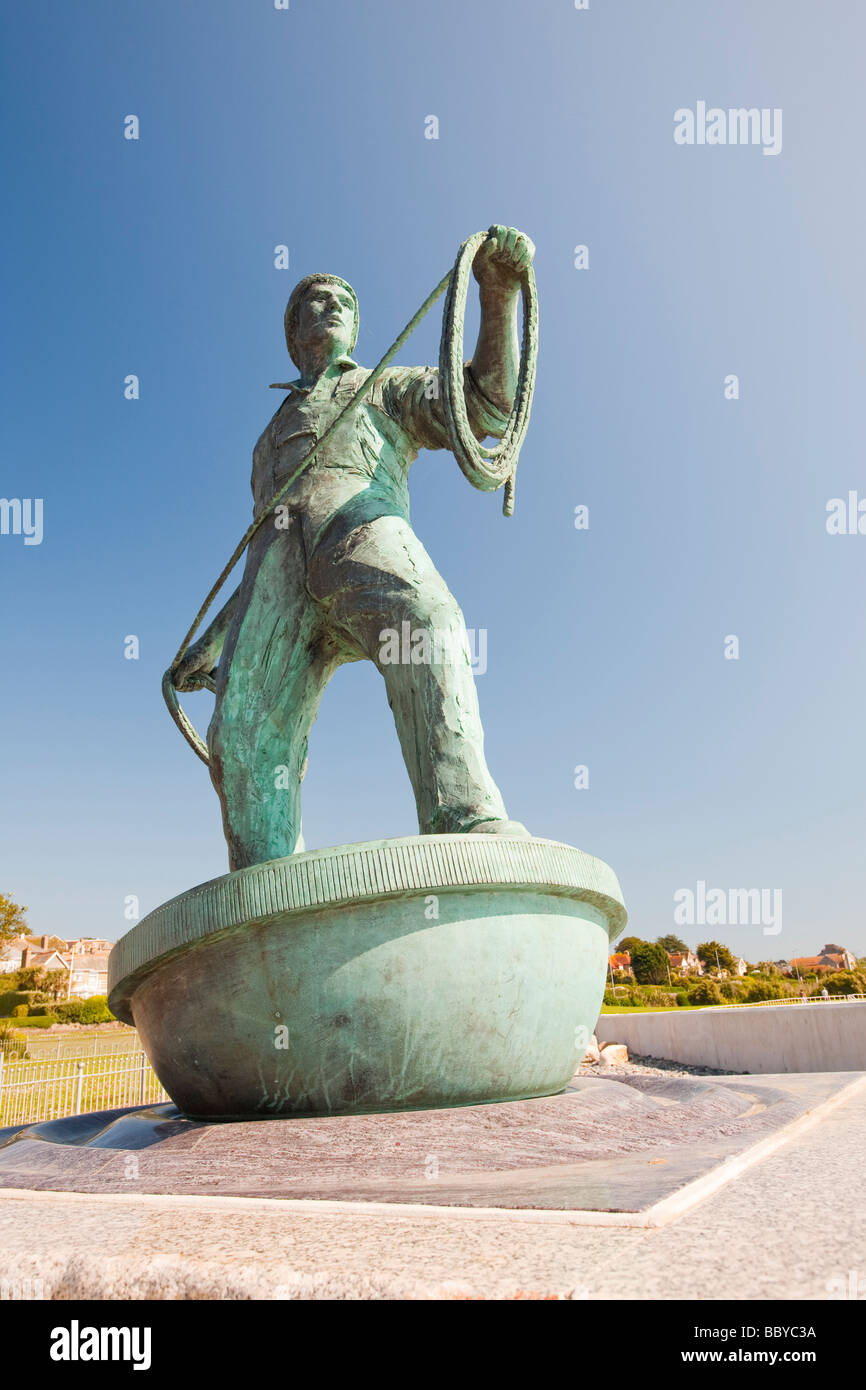 A statue of a young fisherman by local artist Tom Leaper in Newlyn is a ...