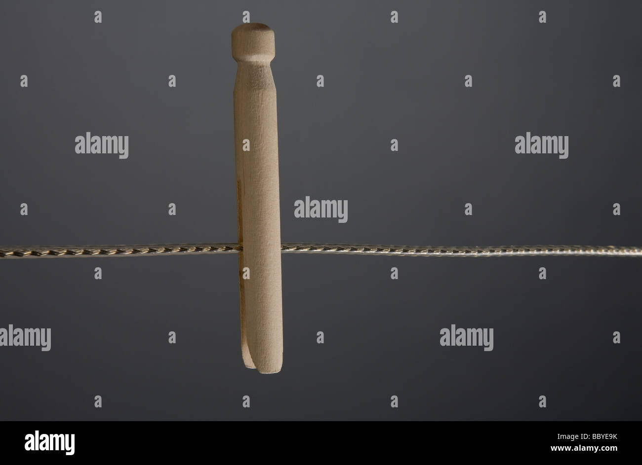 single wooden peg on washing line Stock Photo - Alamy