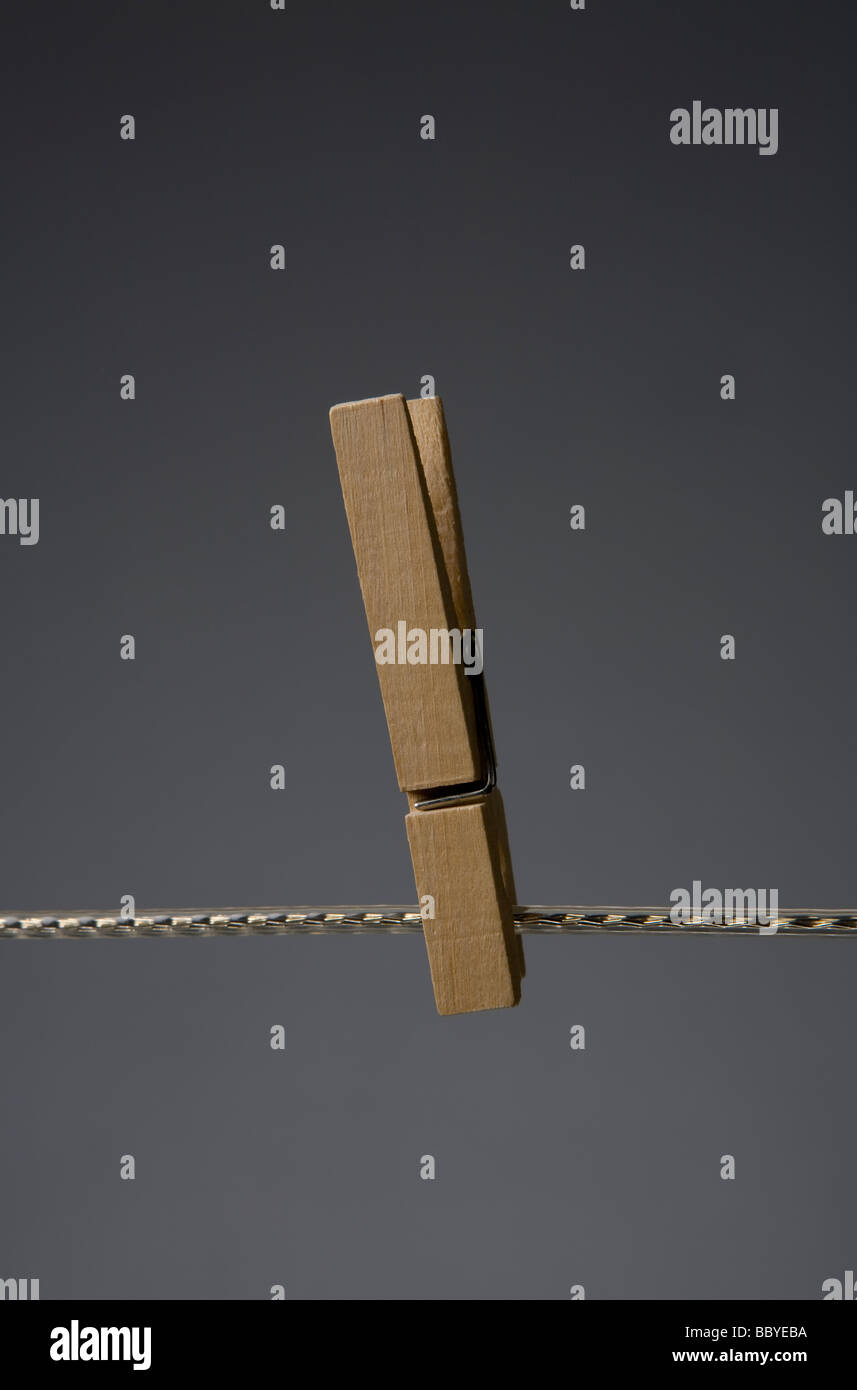 single wooden peg on washing line Stock Photo - Alamy