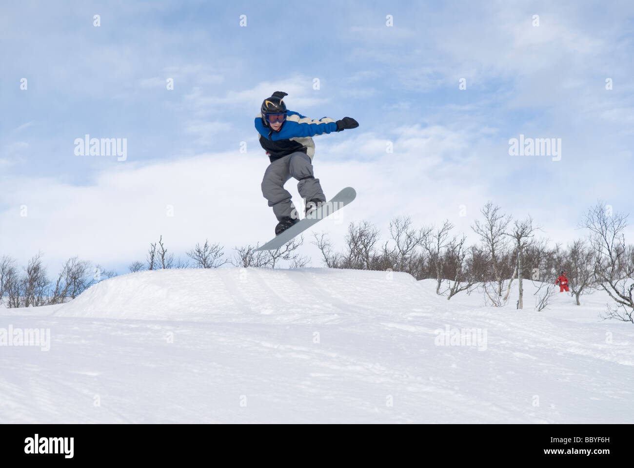 Young boy performing a snowboard jump Stock Photo - Alamy