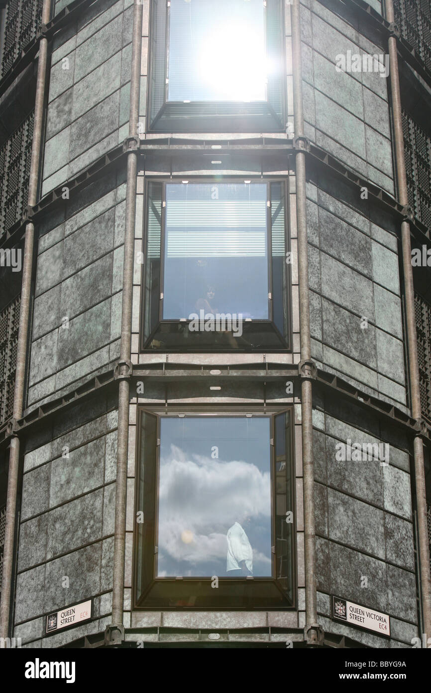 onlookers in a building in london city center looking out of a window ...