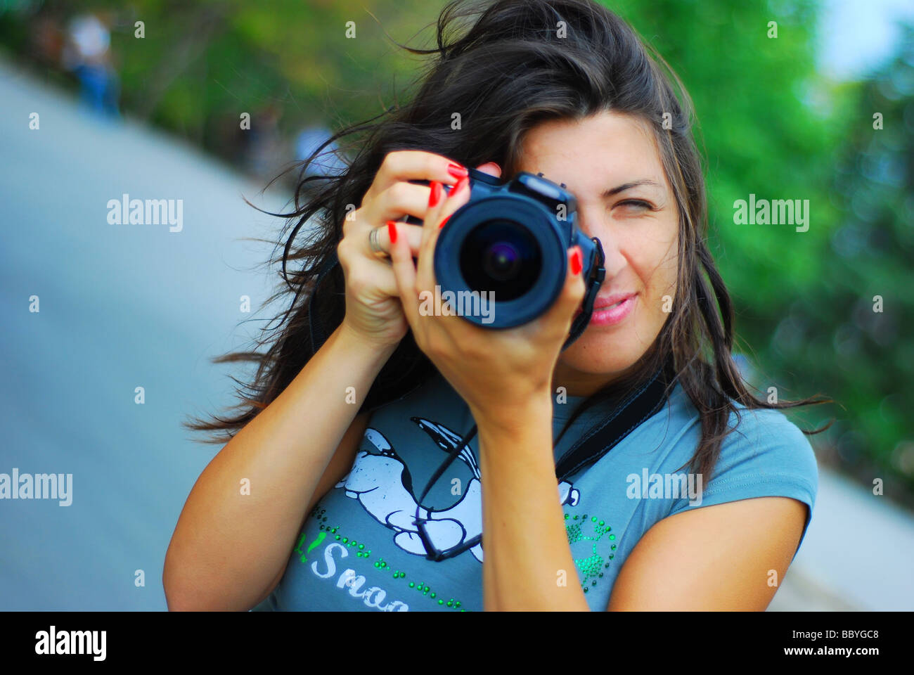 Woman is taking picture with her digital camera Stock Photo - Alamy