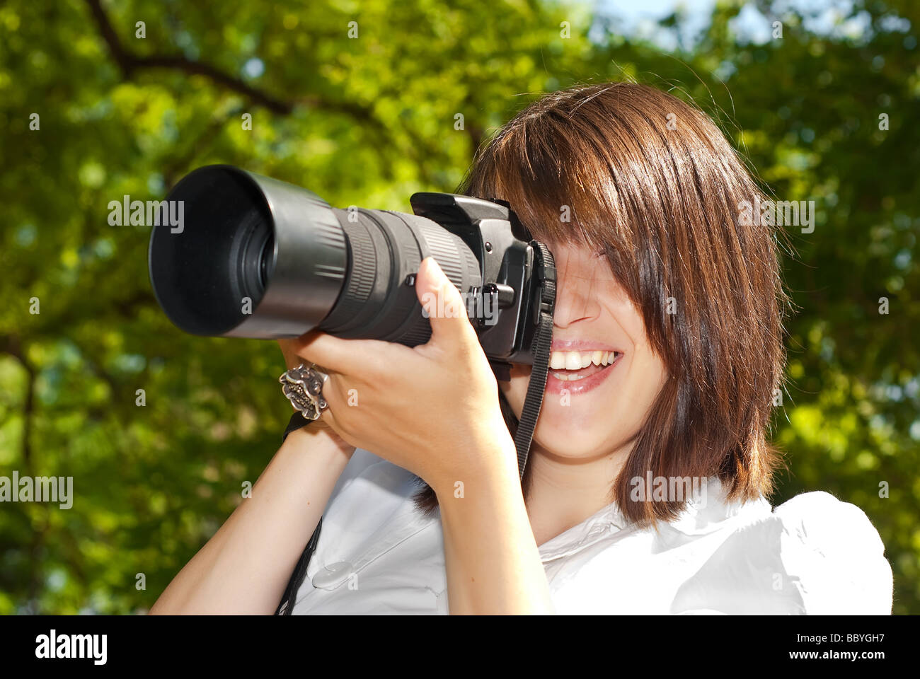 Working photographer with her digital camera Stock Photo - Alamy
