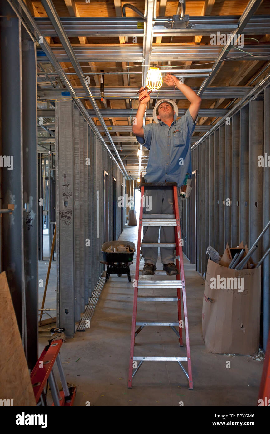 Workers build a Head Start facility to replace a building destroyed by ...