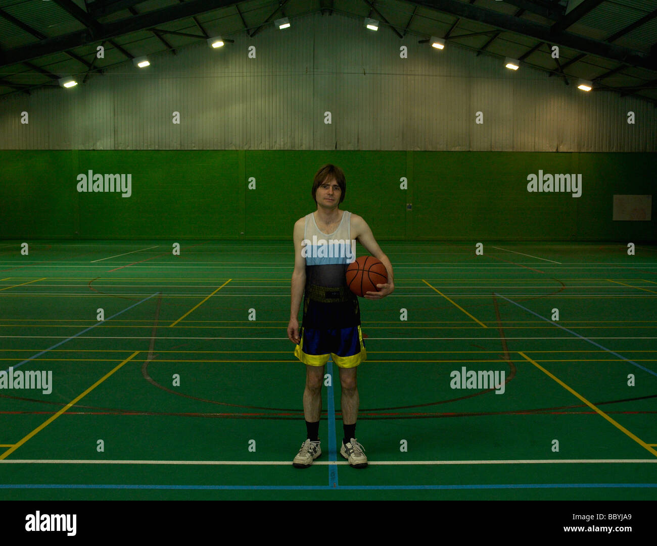 Basketball player on court Stock Photo - Alamy