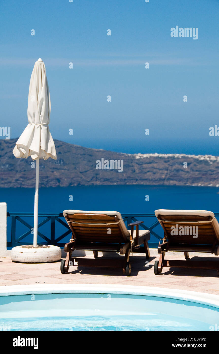 swimming pool at luxury greek island hotel with cyclades santorini view ...