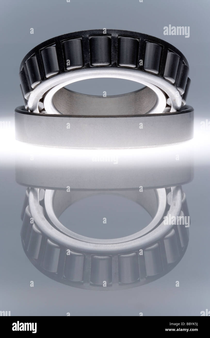 A tapered roller bearing shot a white background with added colour ...