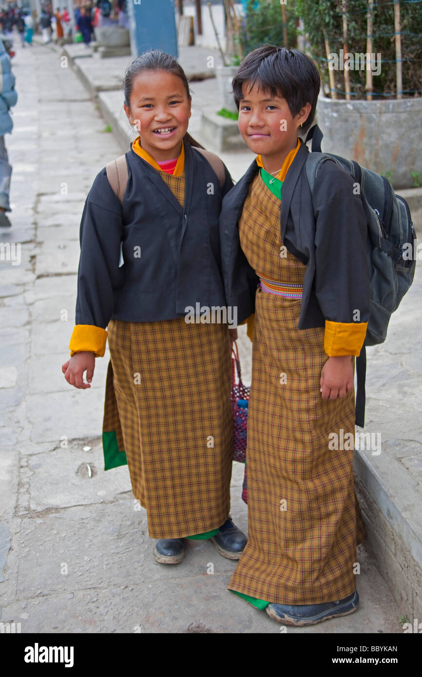 Students wearing traditional dress uniform in street in Thimphu Bhutan ...