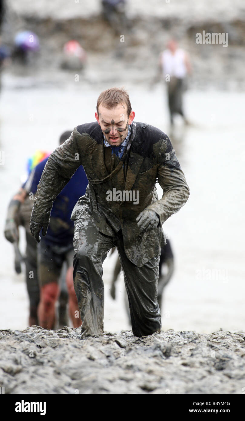 The Mad Maldon Mud Race held in the river Blackwater at Maldon Essex ...