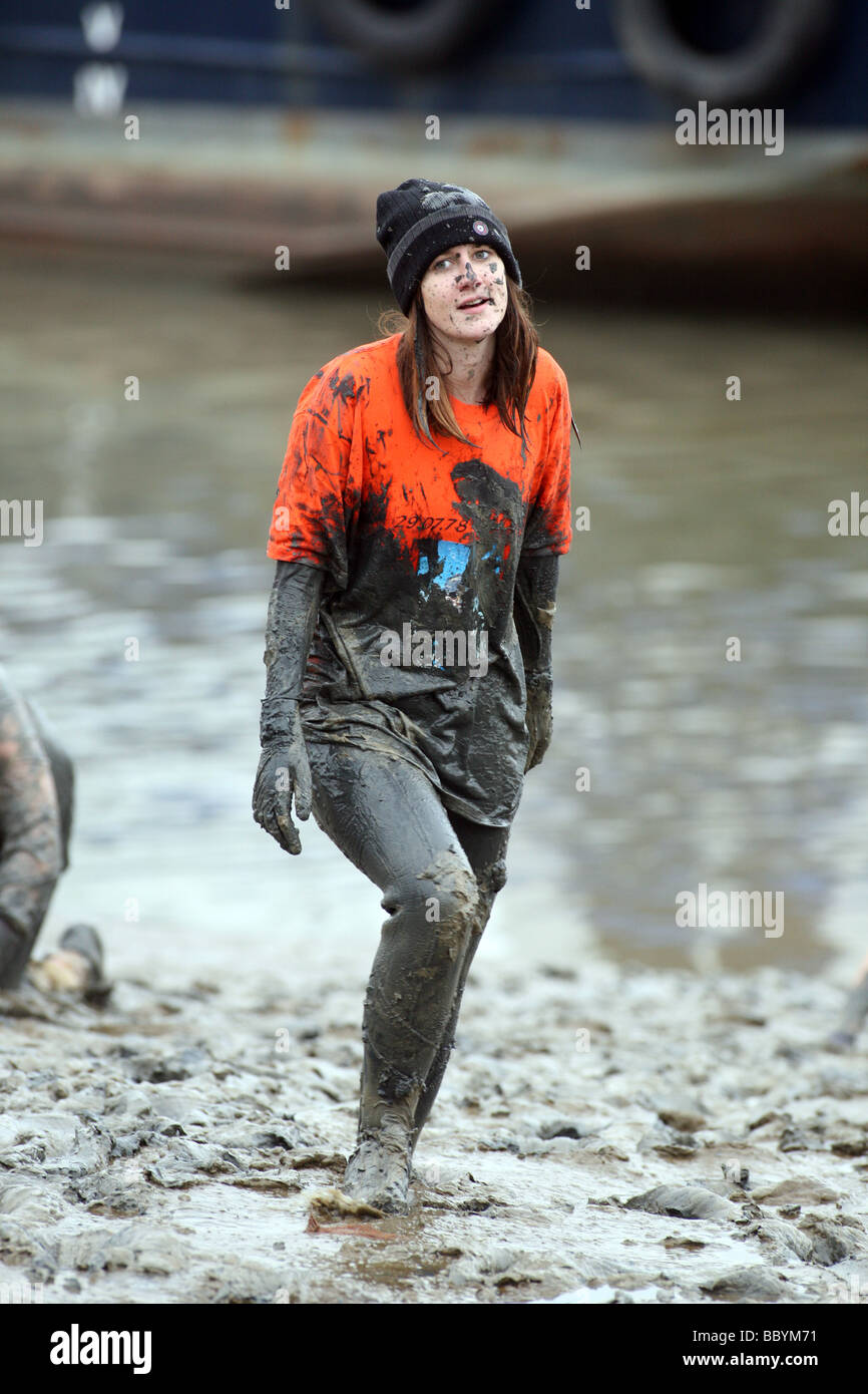 An exhausted contestant in the Mad Maldon Mud Race held in the river ...