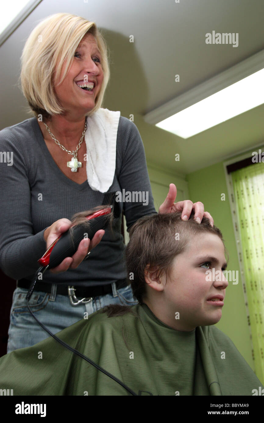 Kid getting a haircut Stock Photo - Alamy