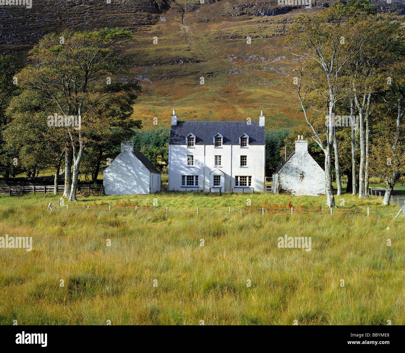 A charming Applecross manor is surrounded by the green of hills and ...