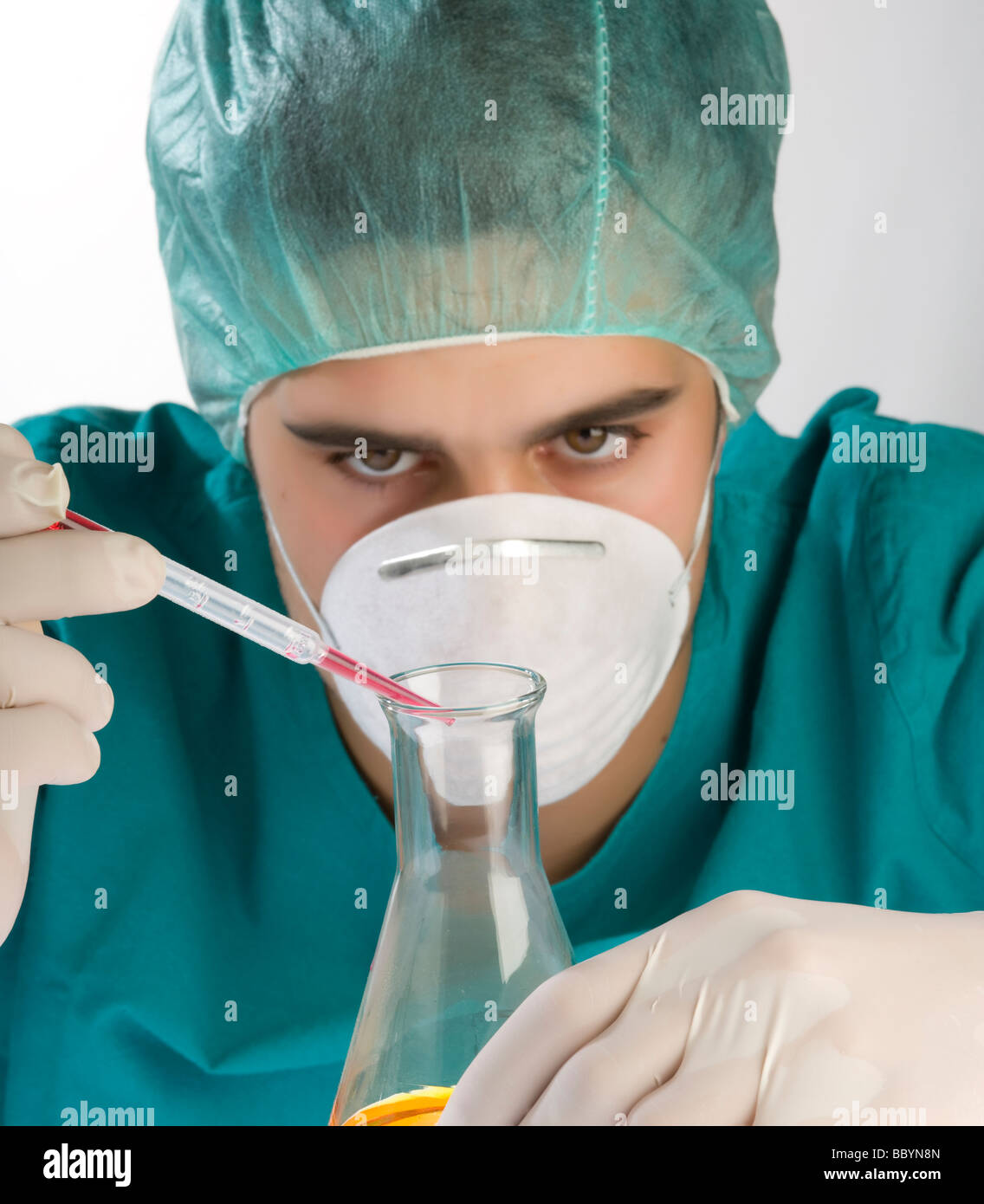 Scientist taking a probe in a labor scene with testtubes and beaker ...