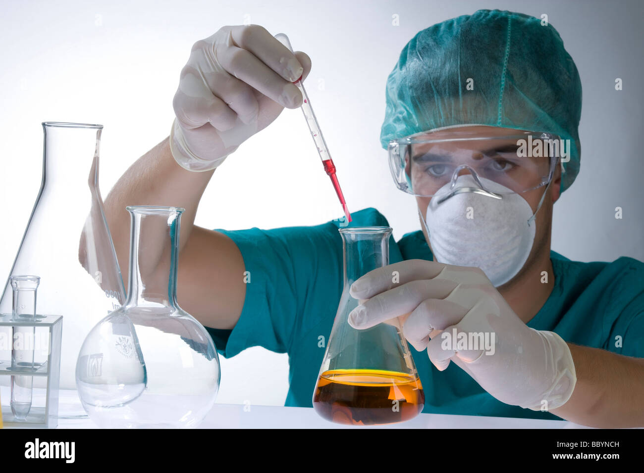 Scientist taking a probe in a labor scene with testtubes and beaker ...