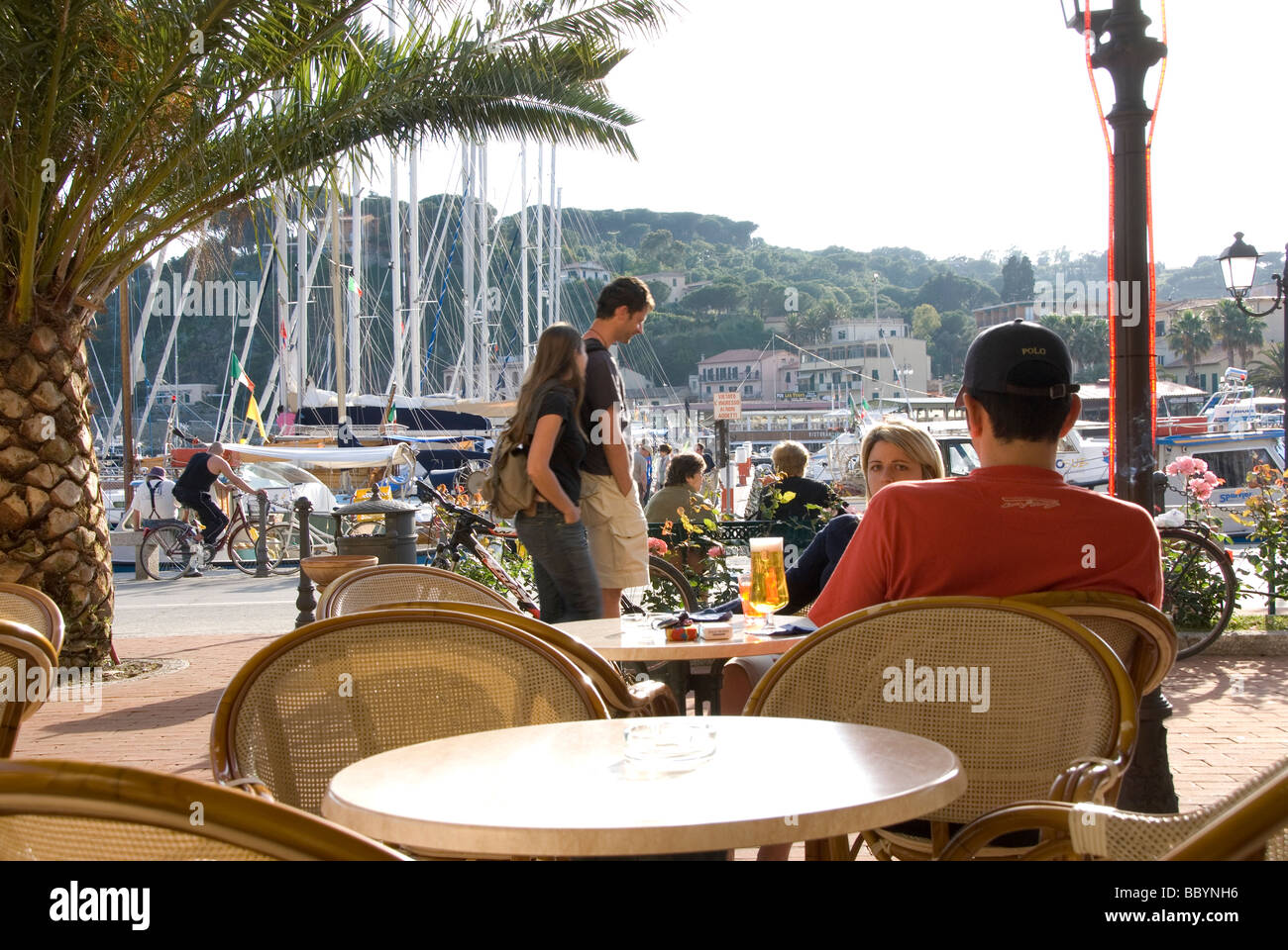 Quayside bar in the marina resort of Porto Azzurro on the Island of ...