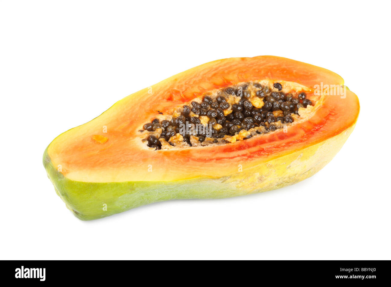 A fresh papaya fruit isolated on white background Shallow depth of ...