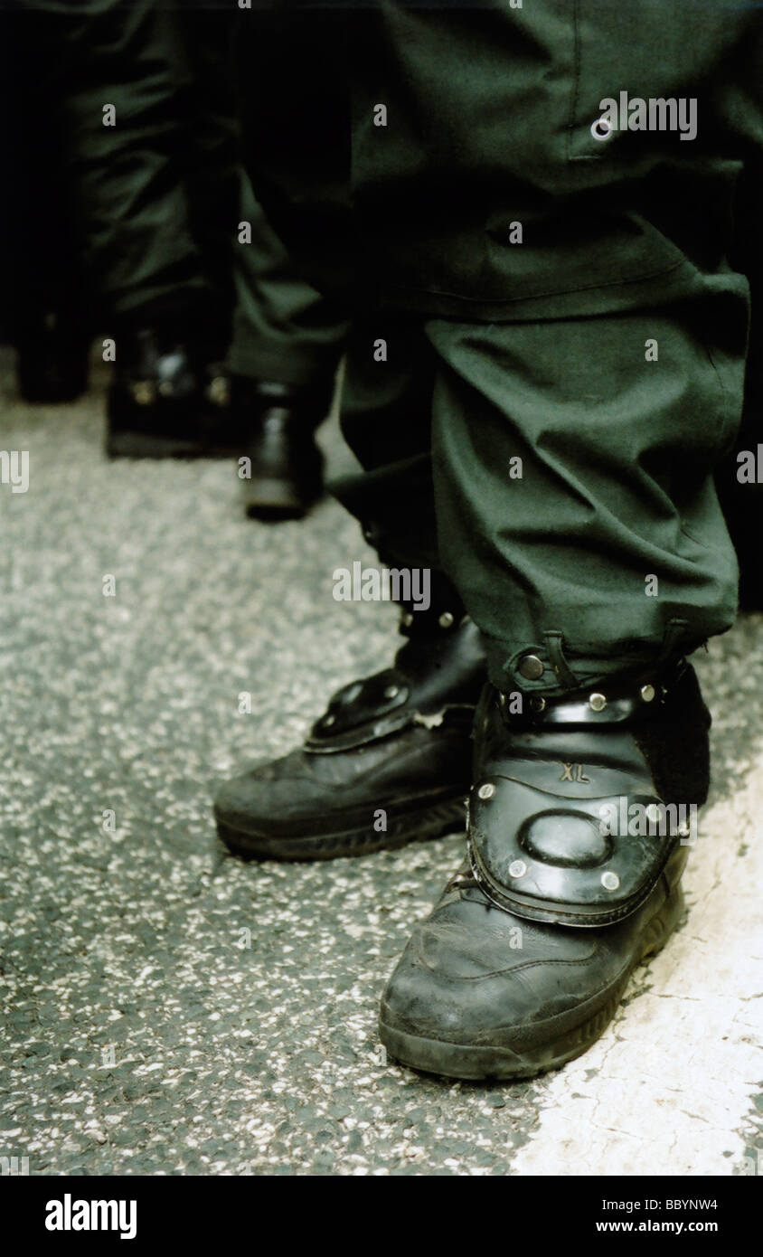 Booted feet of police in riot gear at the G8 in Rostock, Germany, 2007 ...