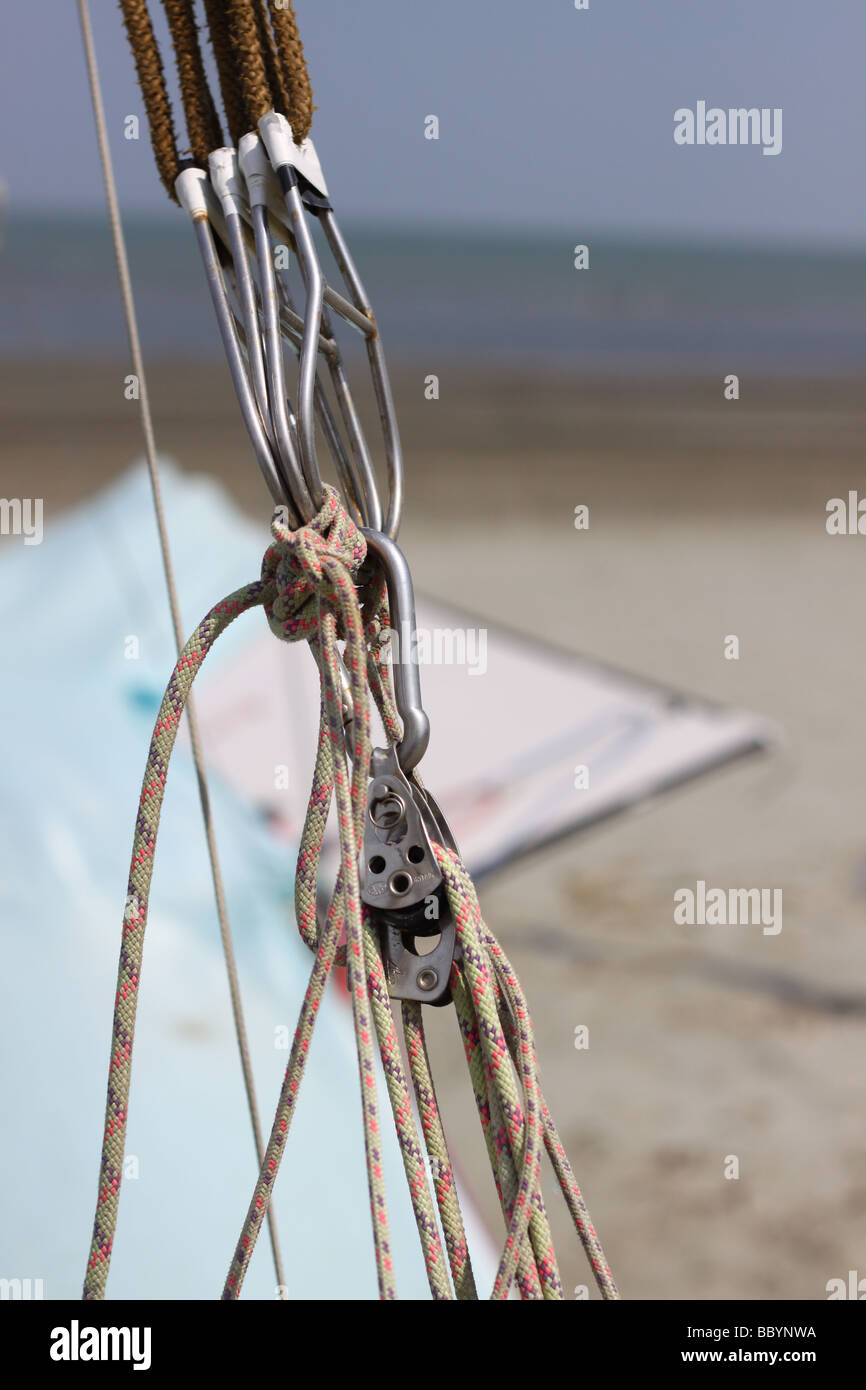 Trapeze ropes with pulley block from a sail boat on a beach Stock Photo ...