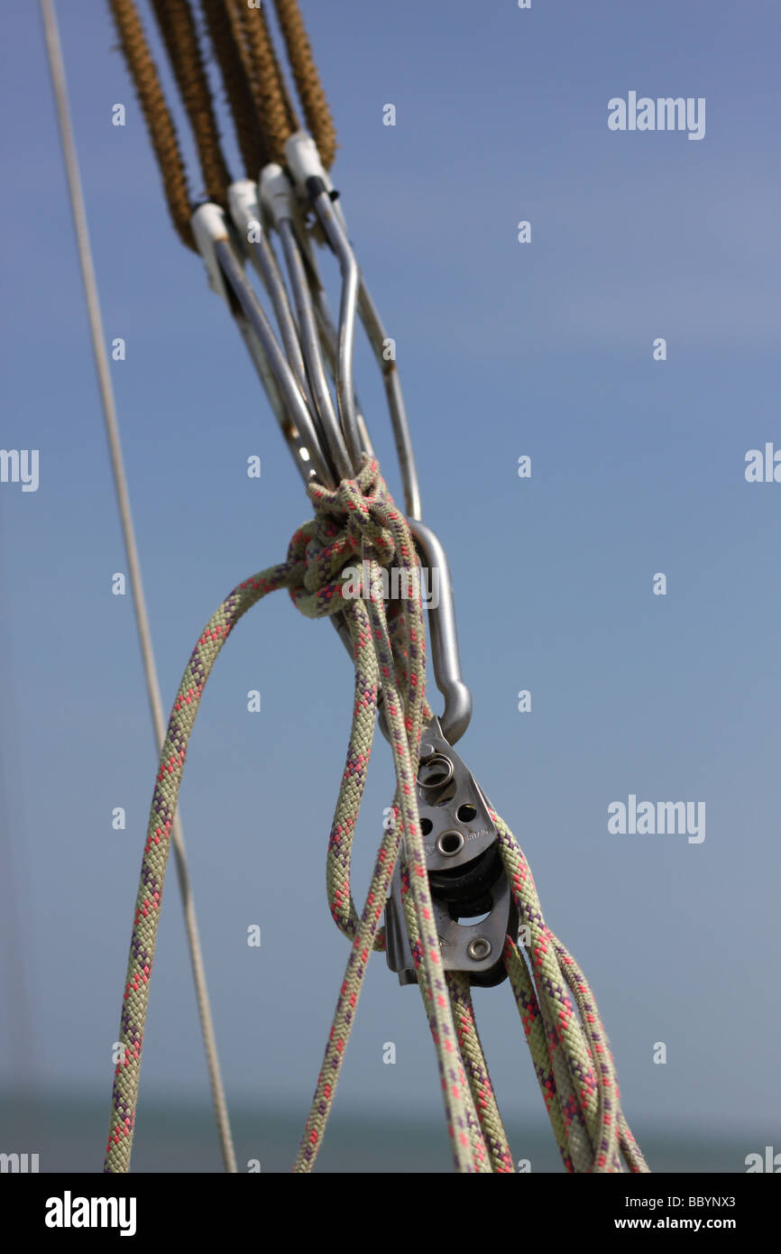 Trapeze ropes with pulley block from a sail boat on a beach Stock Photo ...