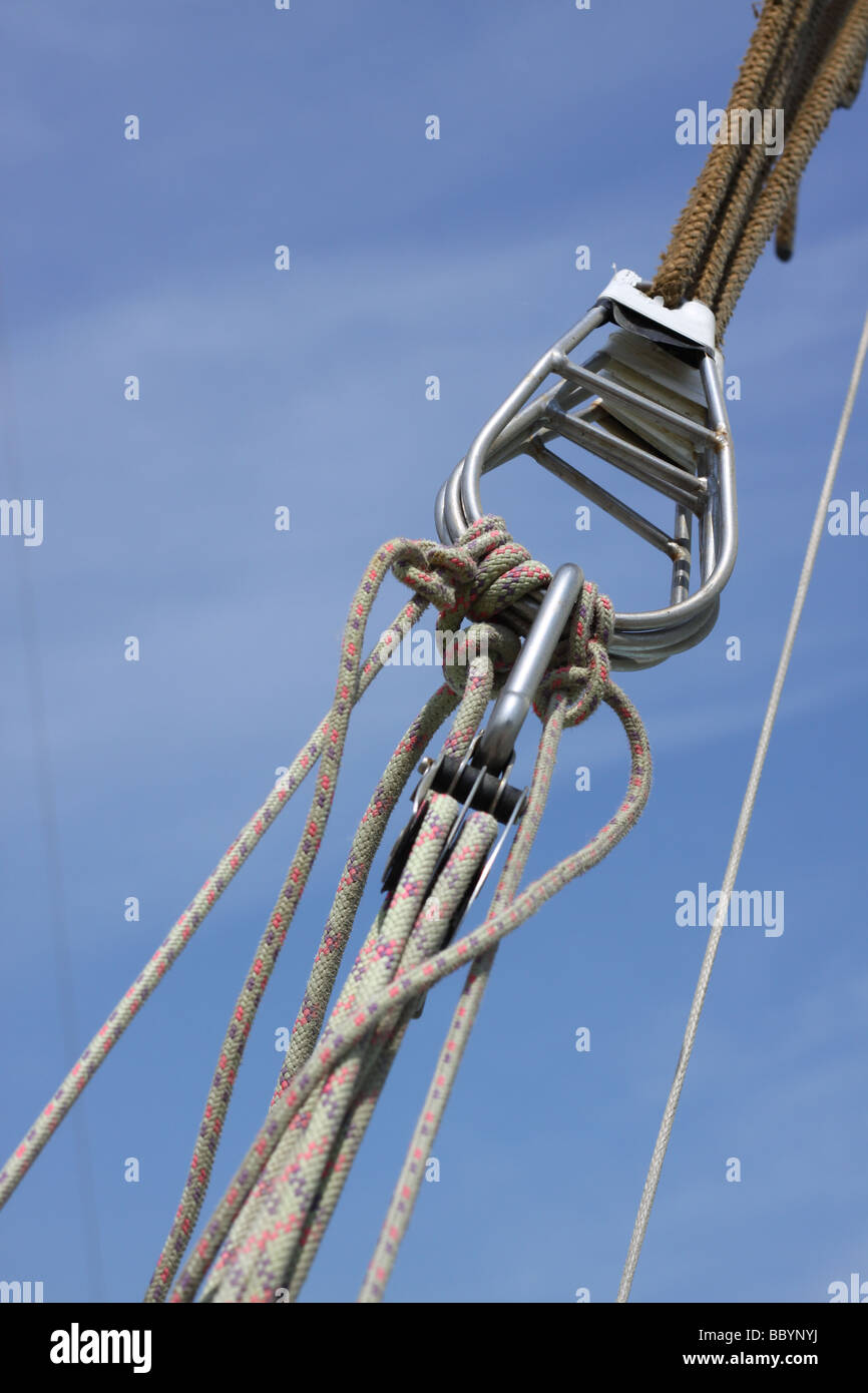 Trapeze ropes with pulley block from a sail boat on a beach Stock Photo ...