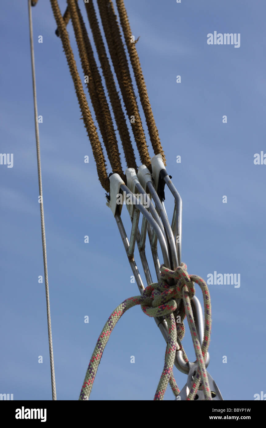 Trapeze ropes with pulley block from a sail boat on a beach Stock Photo ...