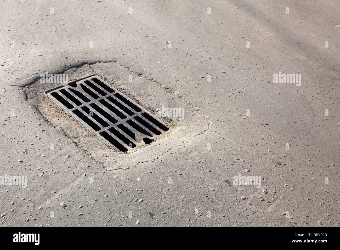 Metal lattice of a drain on road Stock Photo - Alamy